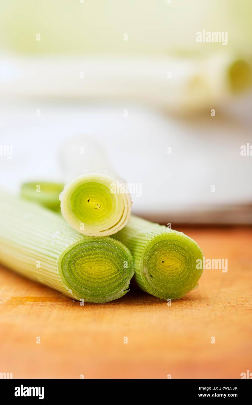 Leek sticks for preparation on a board Stock Photo - Alamy
