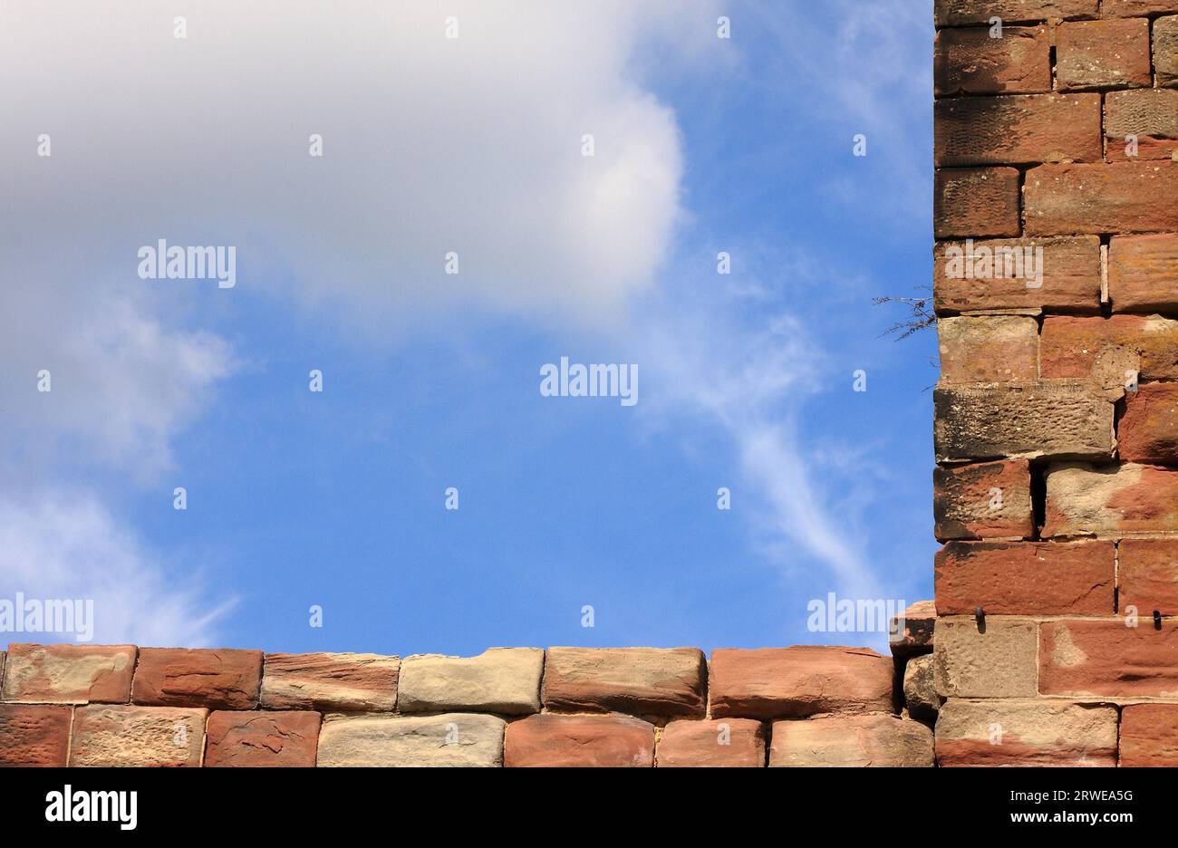 Half framed by a wall projection, background blue-white sky Stock Photo ...