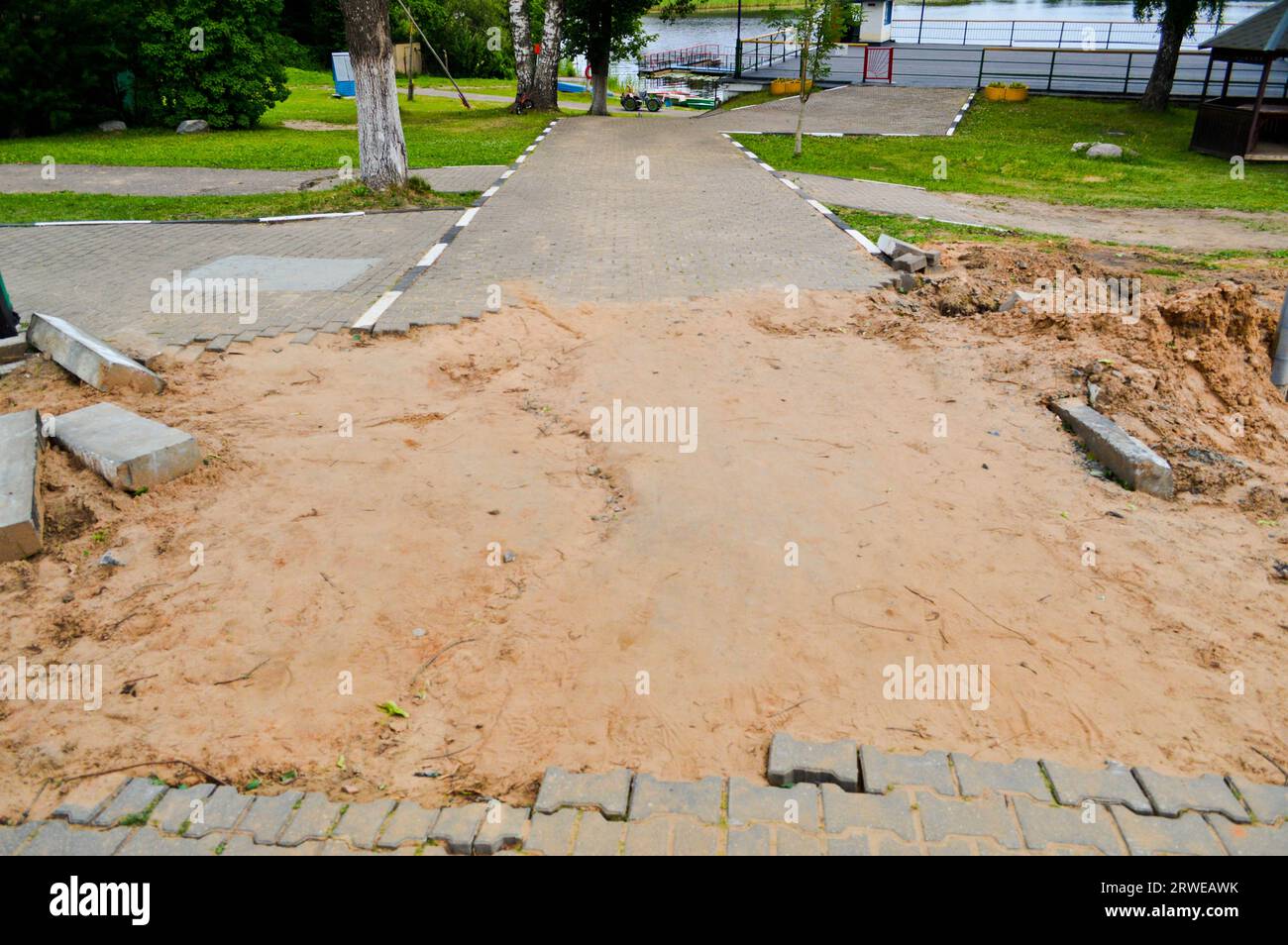 Disassembled road pavement of paving cement concrete tiles, bricks ...