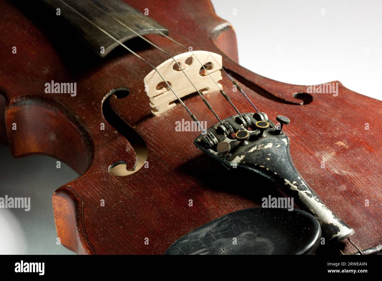 Extremely old master violin on light background Stock Photo - Alamy