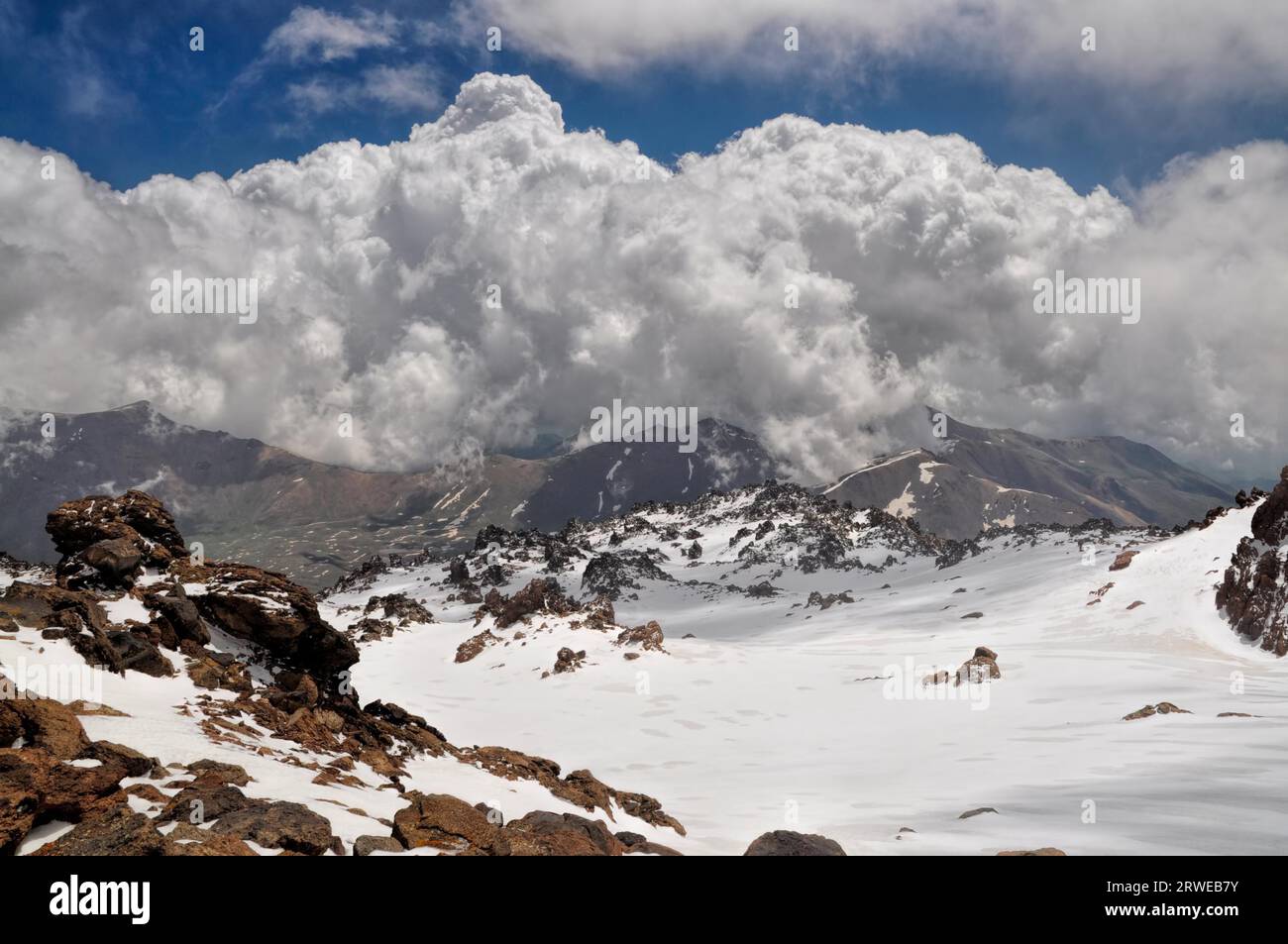 Stormy clouds forming over the top of mountains around Sabalan volcano ...