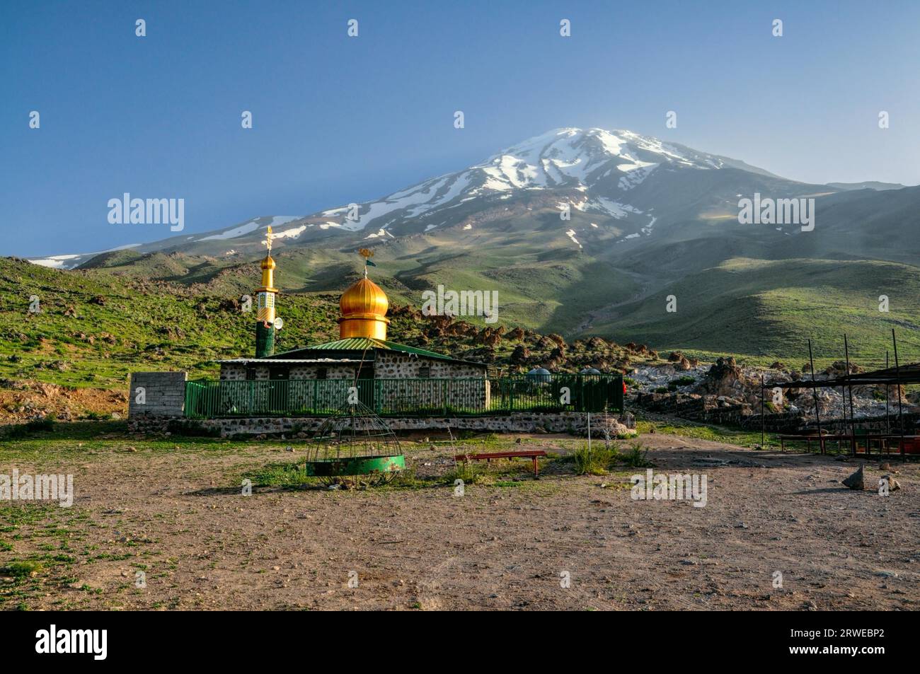 Mosque with golden roof underneath volcano Damavand, highest peak in ...