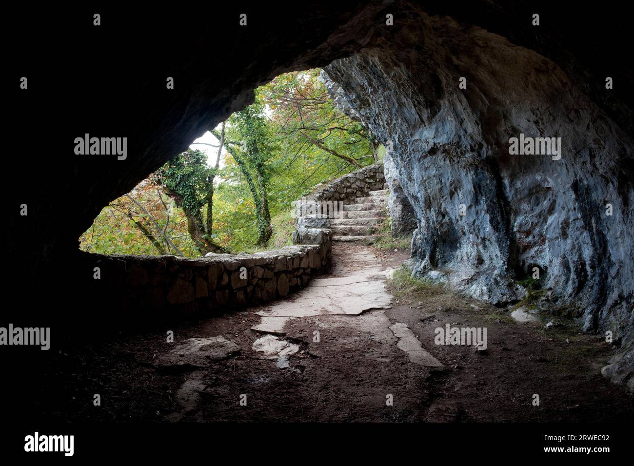 Exit from a mountain cave Stock Photo - Alamy