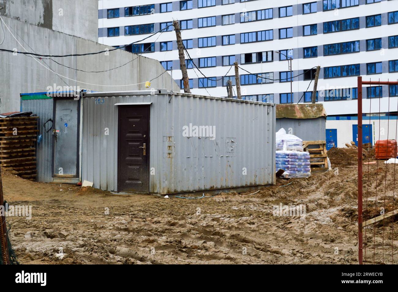 Small temporary houses of builders from containers at an industrial ...