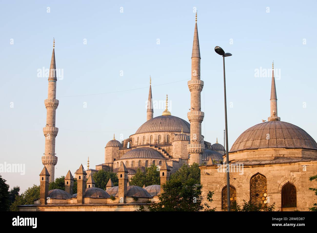 Domes and minarets of the Blue Mosque (Sultan Ahmet Camii) at sunrise ...