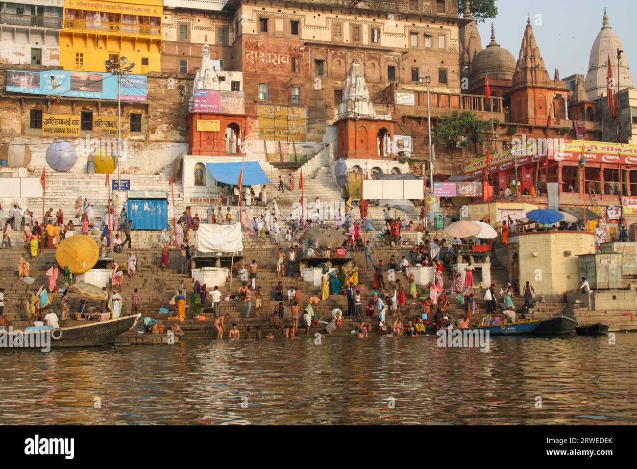 Varanasi, India, April 2, 2011: Hindu pilgrims take holy bath in the ...