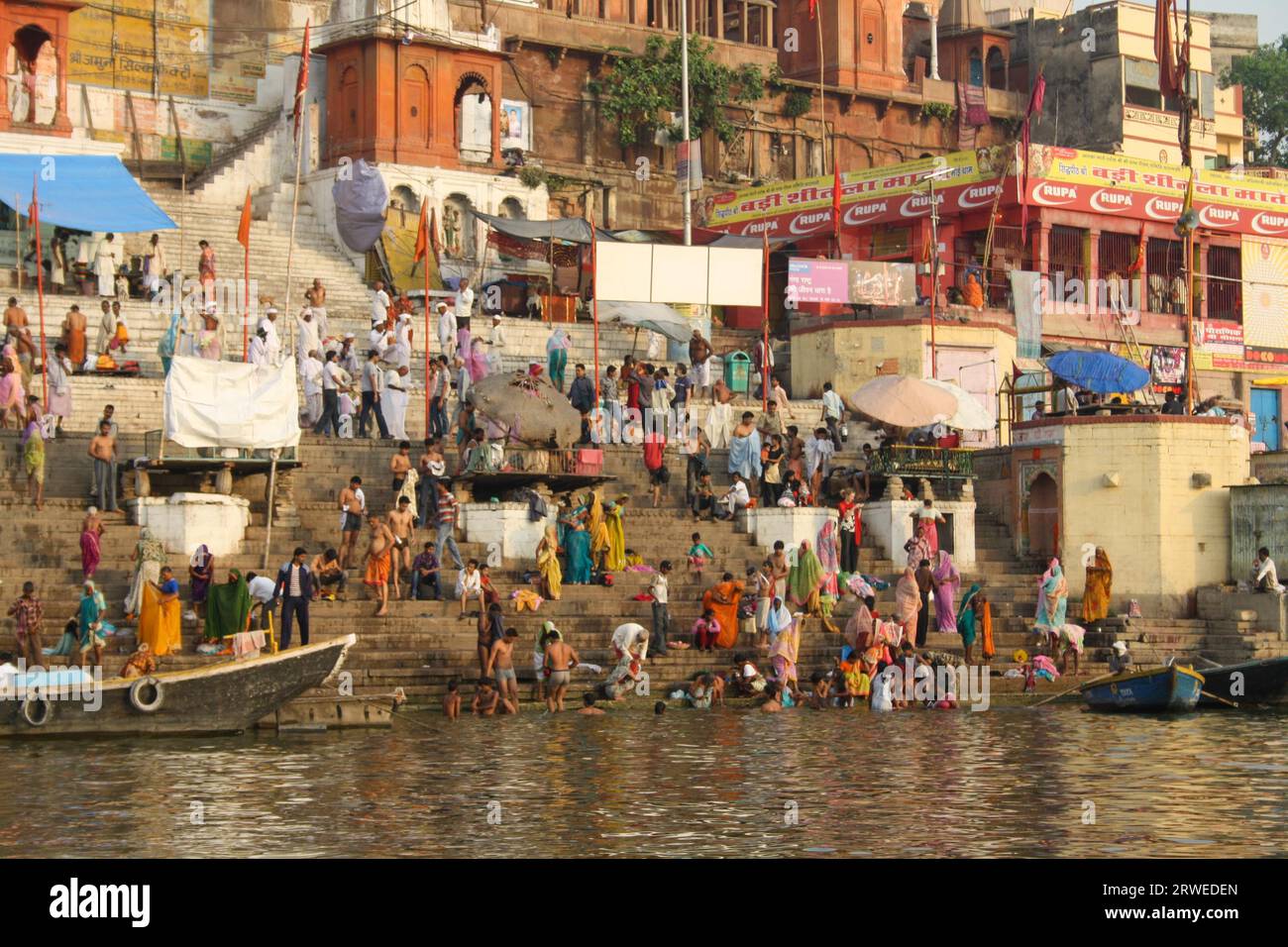Varanasi, India, April 2, 2011: Hindu pilgrims take holy bath in the ...