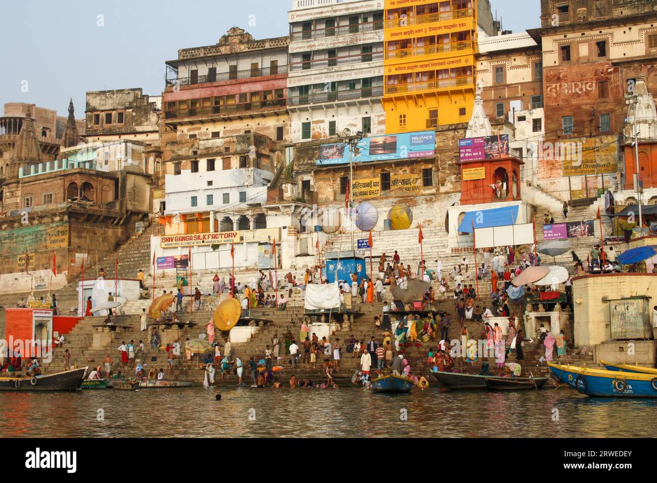 Varanasi, India, April 2, 2011: Hindu pilgrims take holy bath in the ...