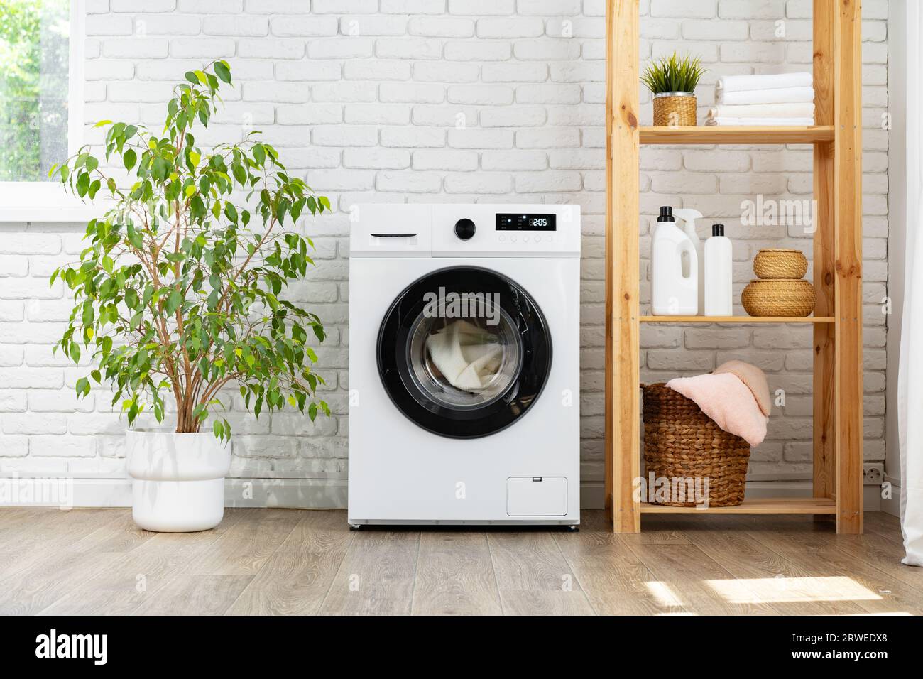 Modern white washing machine close up photo Stock Photo - Alamy