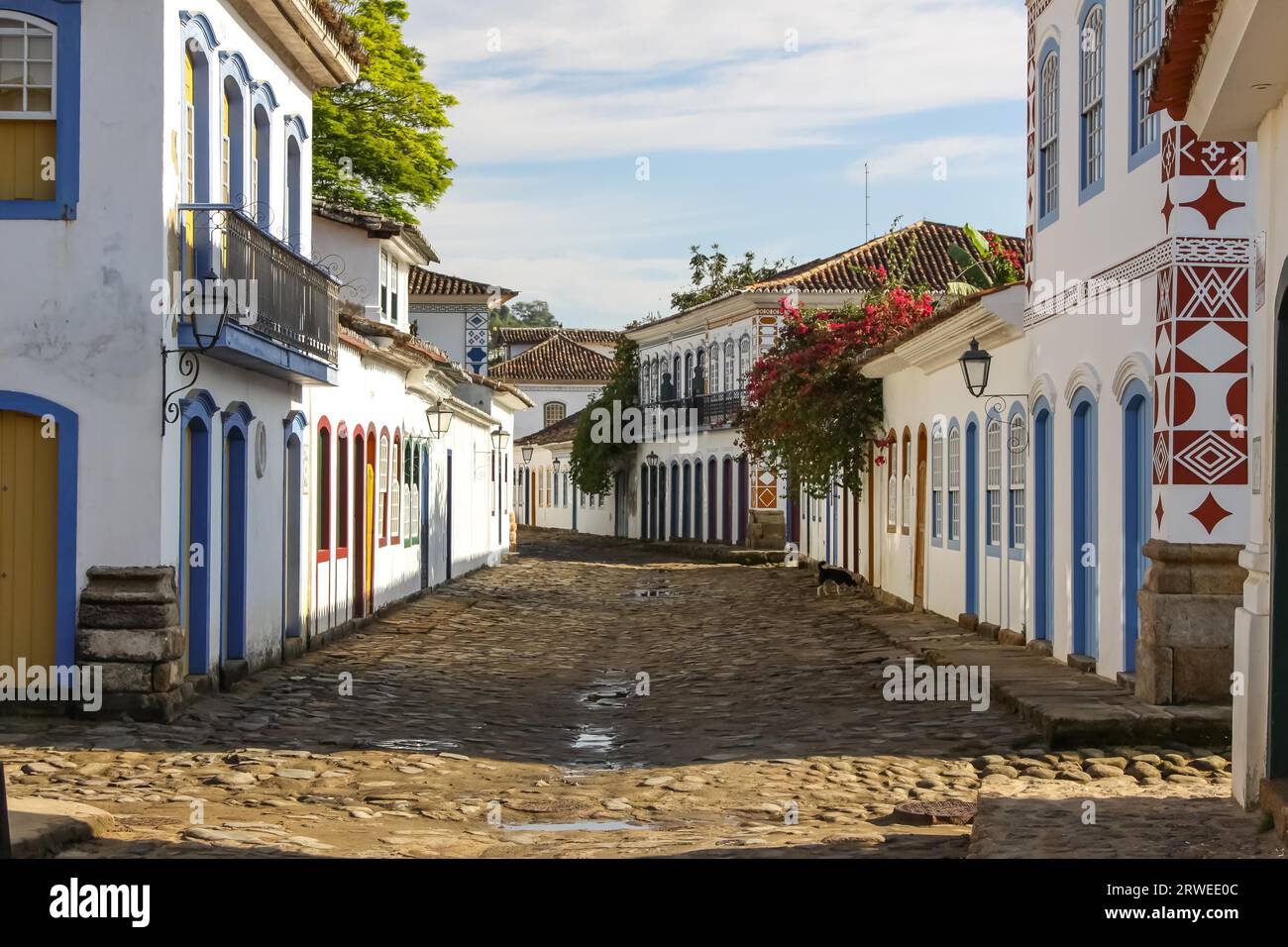Typical cobblestone street with colonial buildings in historic town ...