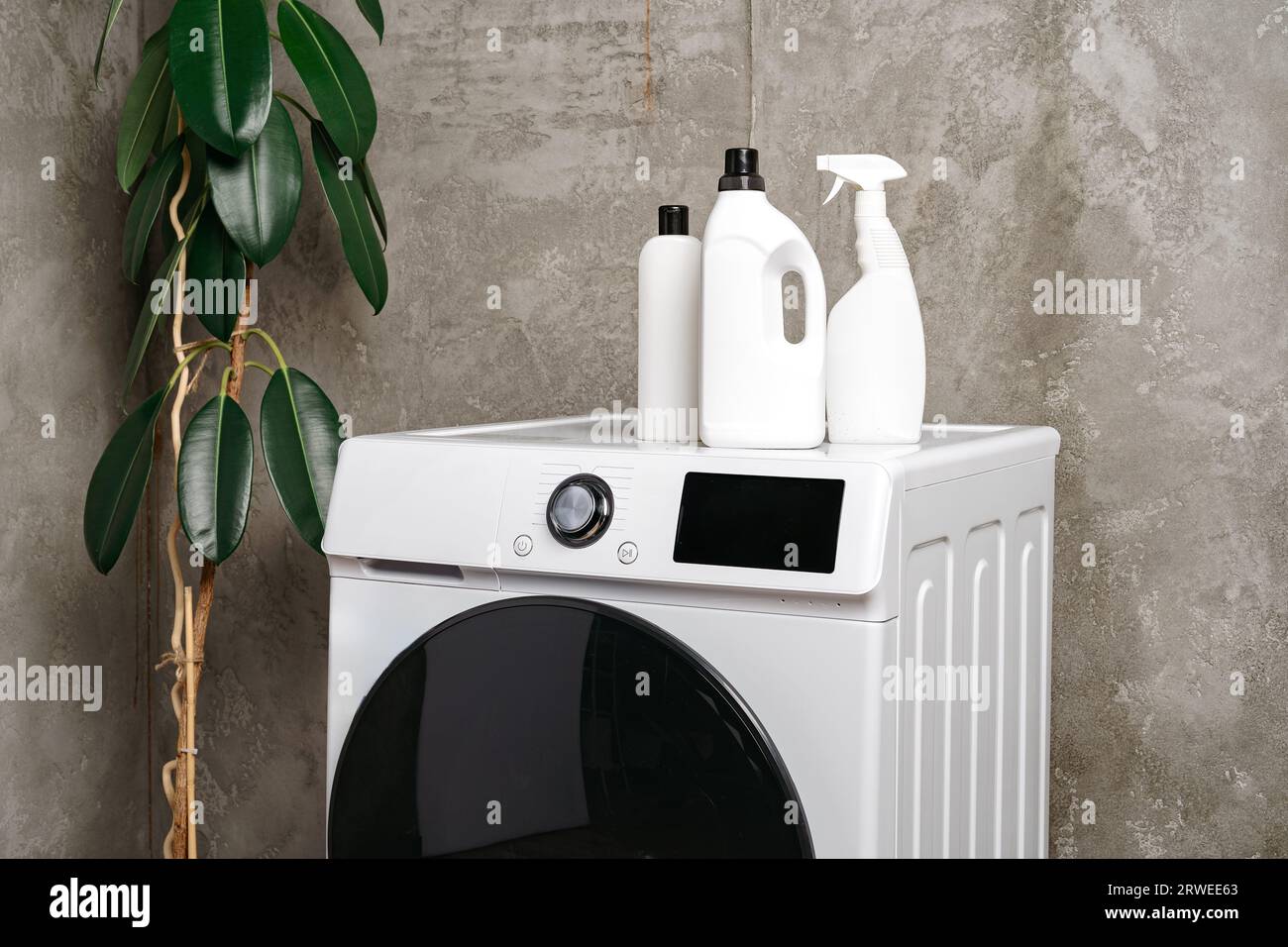 Washing liquid detergents on washing machine in a laundry room Stock ...