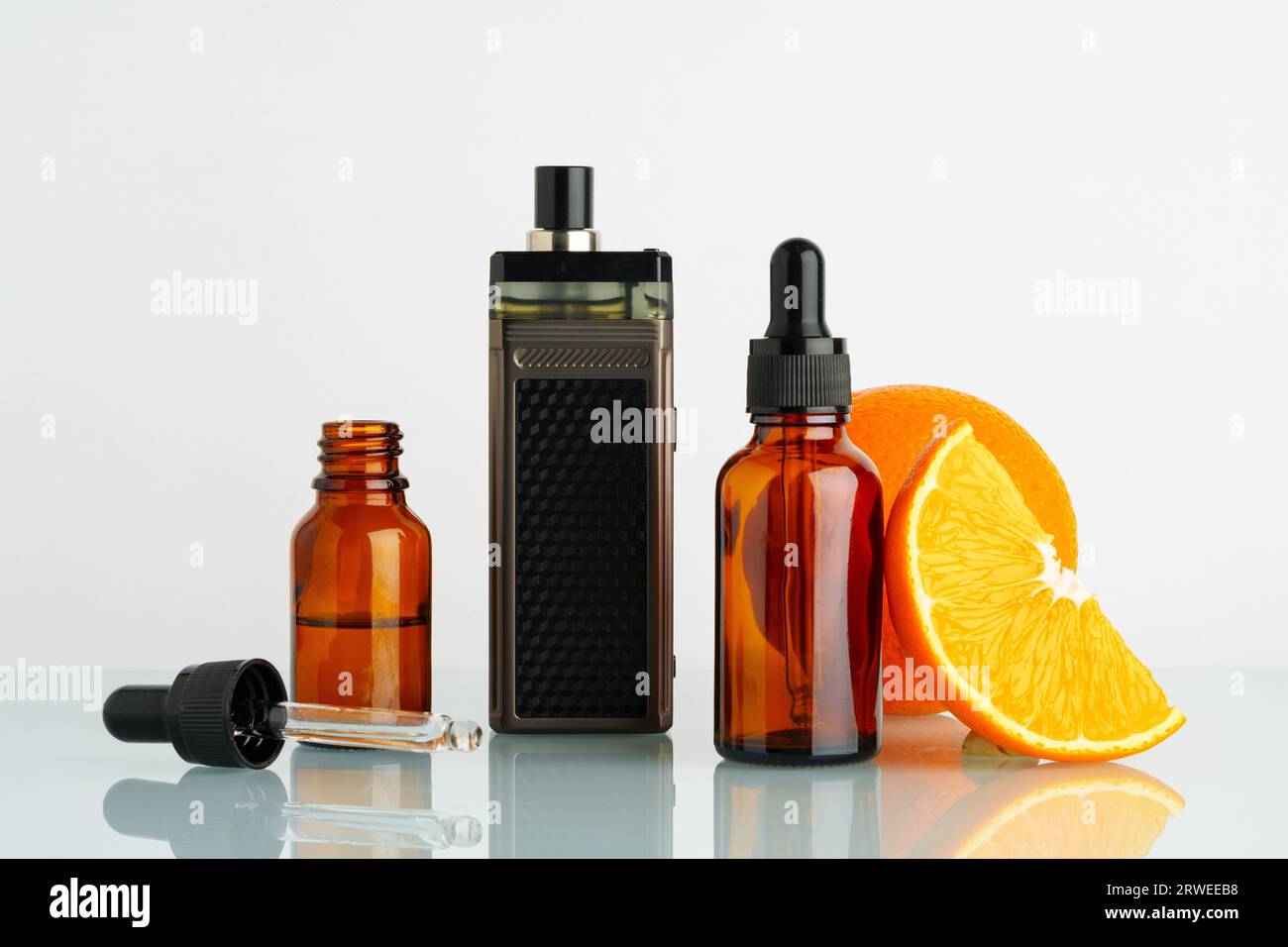 Vape liquid with orange flavor on white background Stock Photo - Alamy