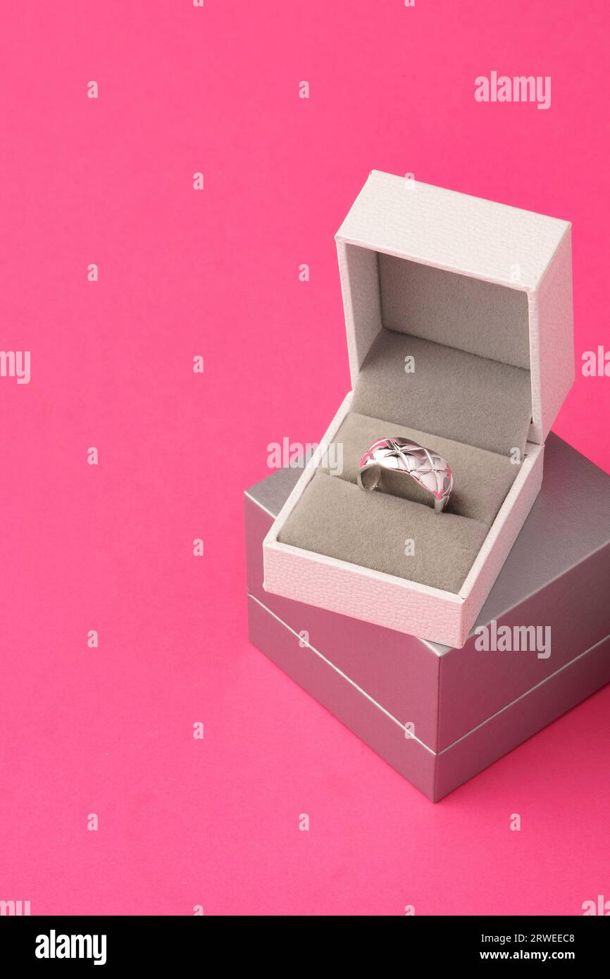 Small jewelry box on pink studio background Stock Photo - Alamy