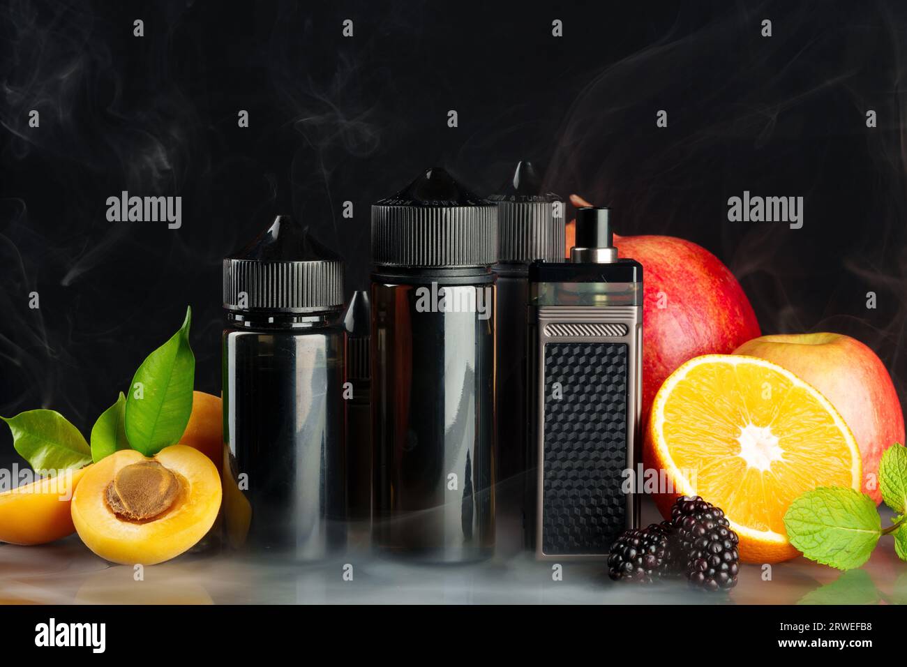 Vape and smoking liquid with fruit against black background with smoke ...