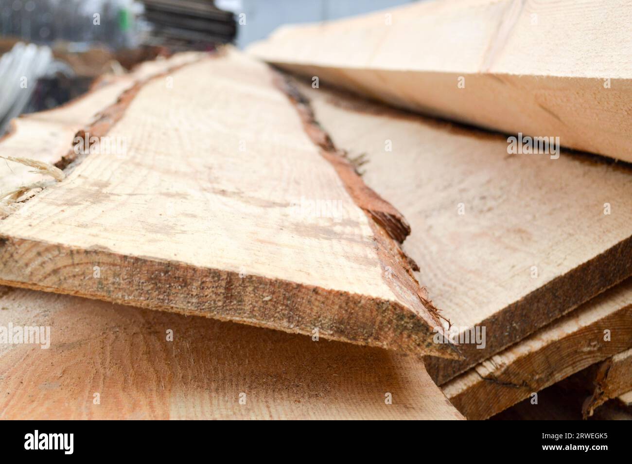 Lots of long wooden natural planed boards and sticks at a sawmill. The ...