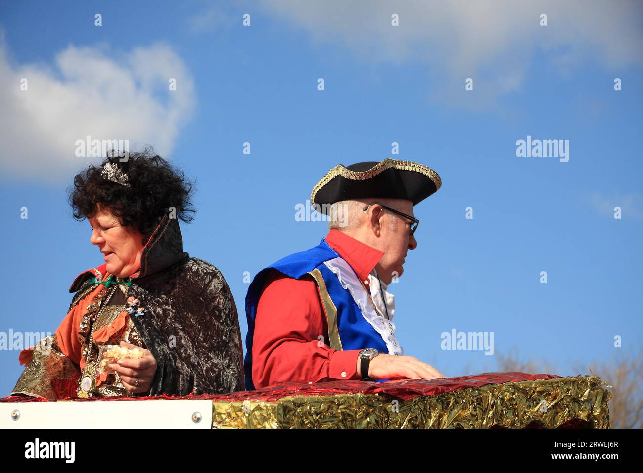 Two carnivalists on the carnival float throw sweets Stock Photo - Alamy