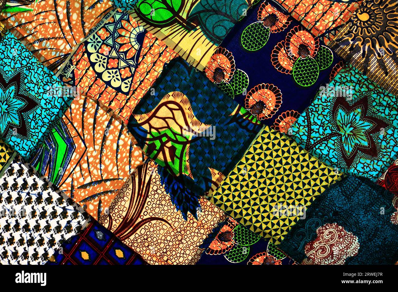 Colourful ethnic patterns, arranged in squares, taken to fill the ...