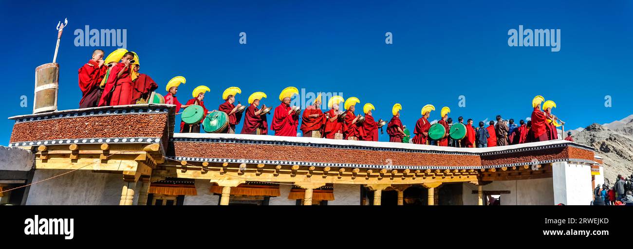 Thiksey, Ladakh, circa November 2011: Monks with traditional big yellow ...