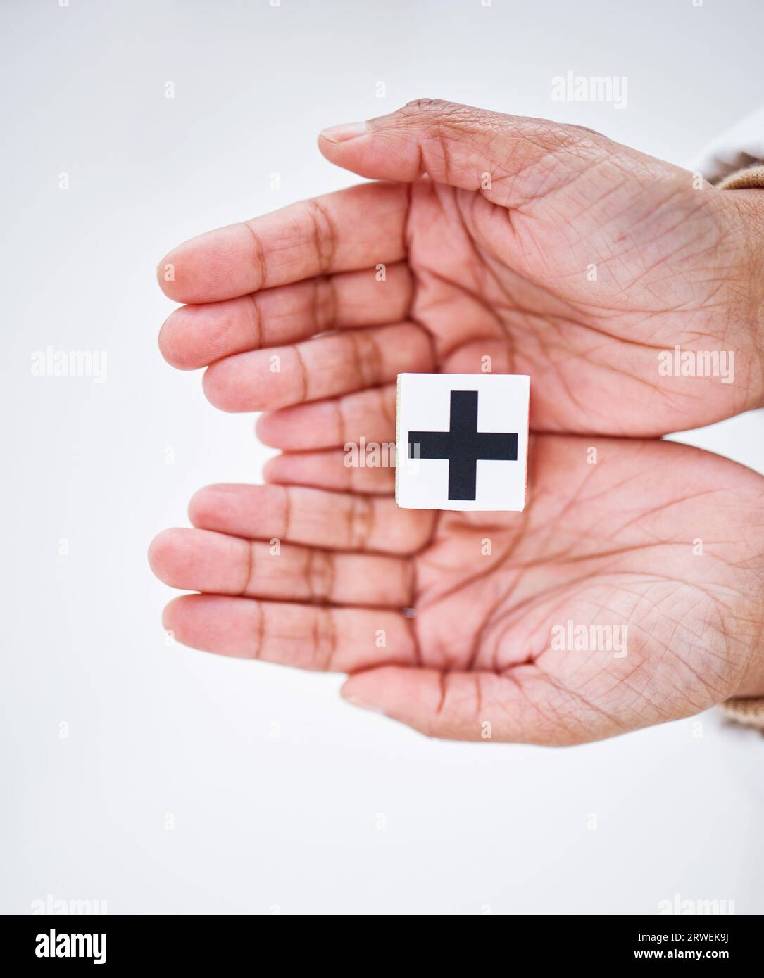 Healthcare, insurance and hands with cross sign for medical service ...