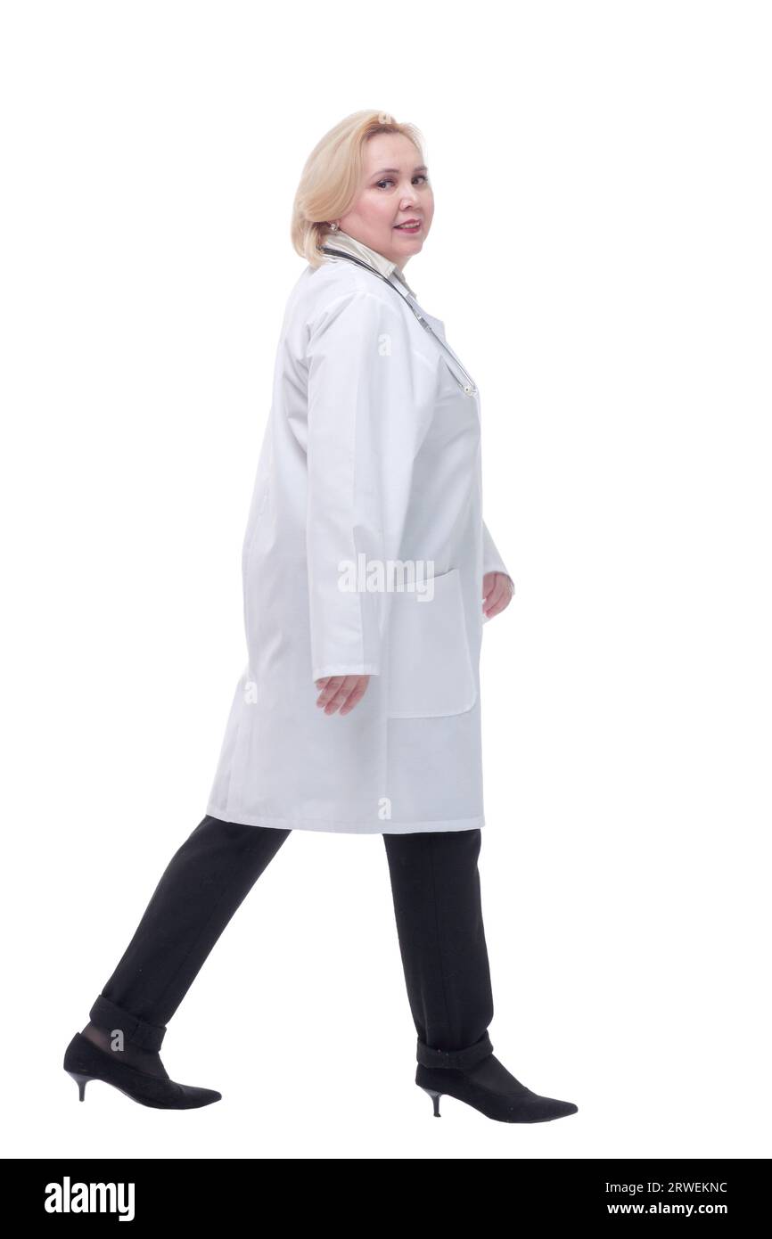 Female doctor walking towards the camera smiling Stock Photo - Alamy