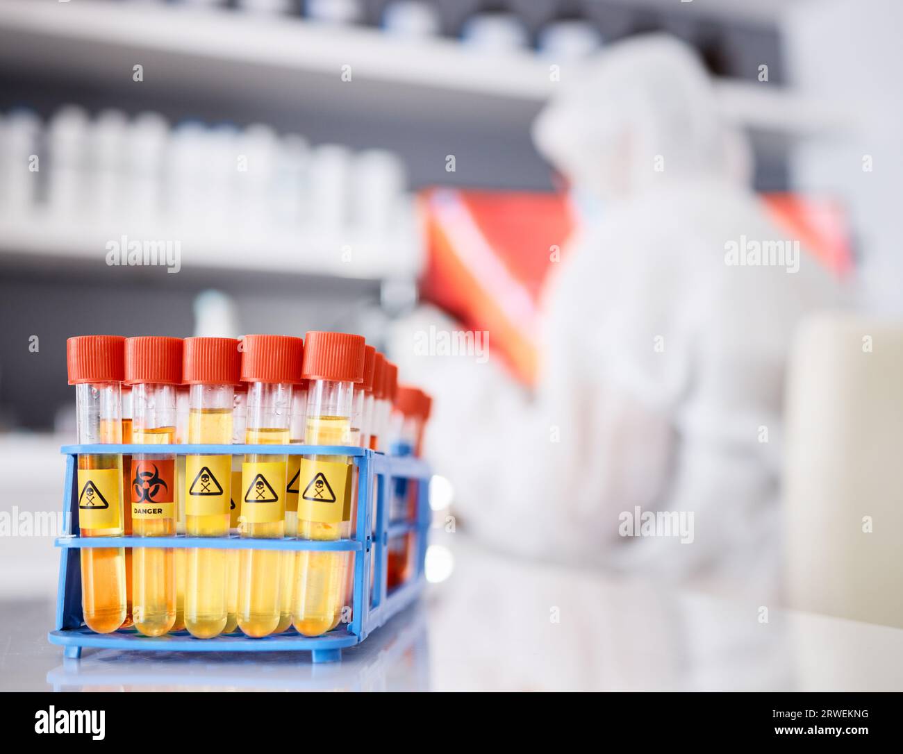 Science, closeup and test tube with warning in laboratory for medical ...