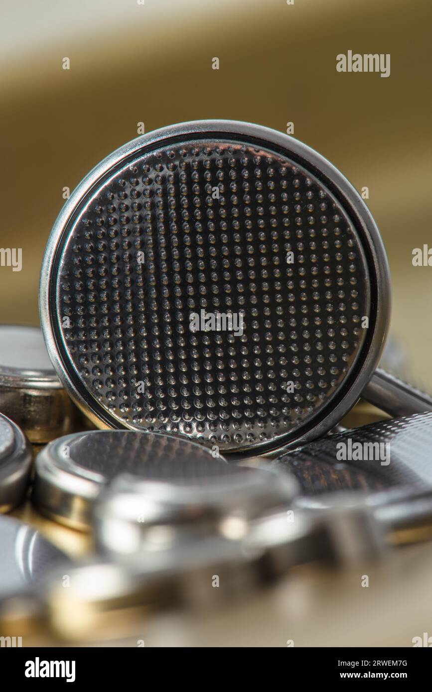 Macro view of button cell lithium battery Stock Photo - Alamy
