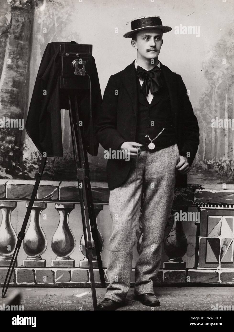 Full-length self-portrait of photographer Emile Schall in his studio in ...