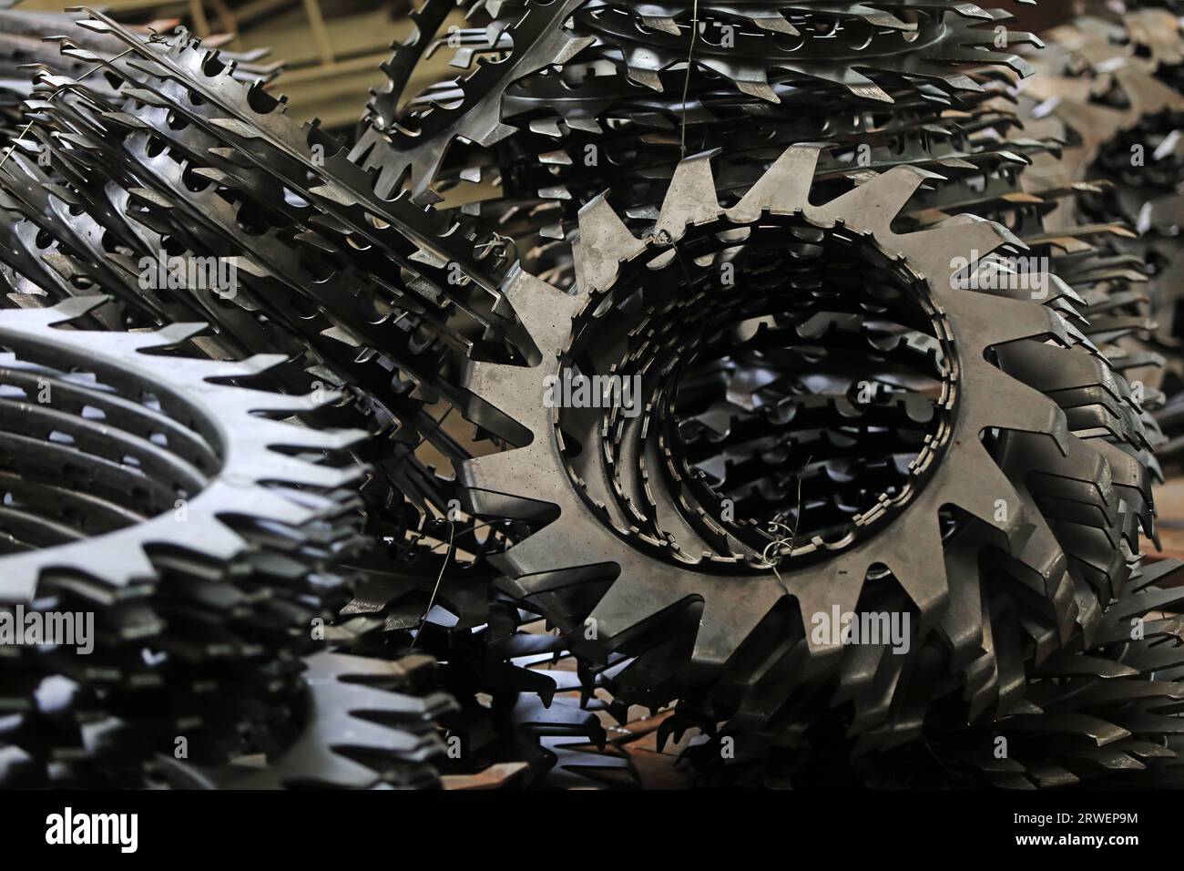 Stainless steel discs are stacked in a production workshop in North ...