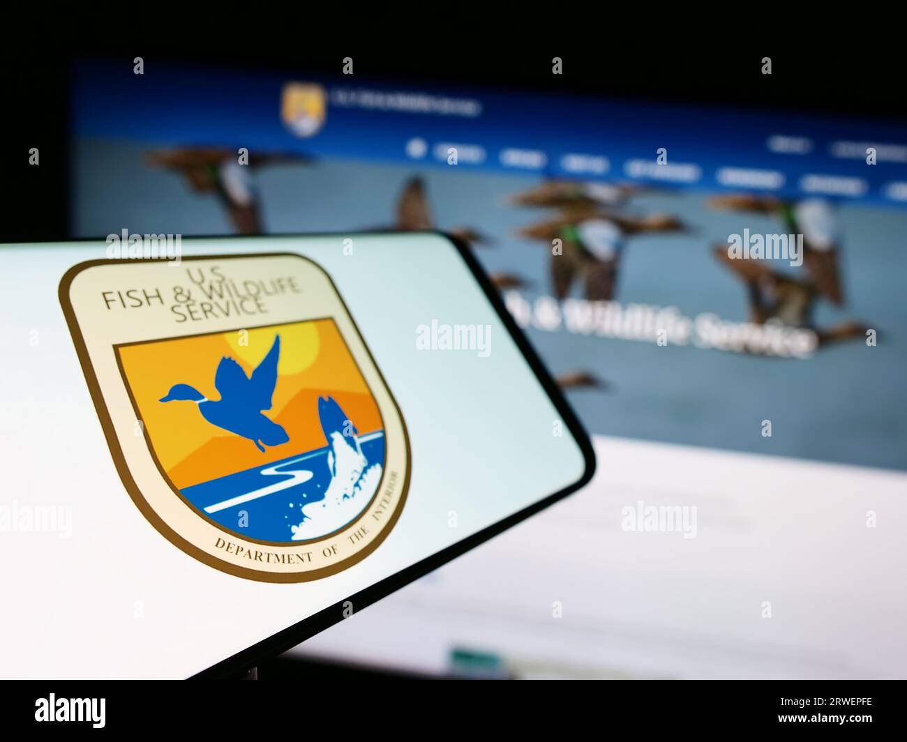 Cellphone with seal of United States Fish and Wildlife Service (FWS) on ...