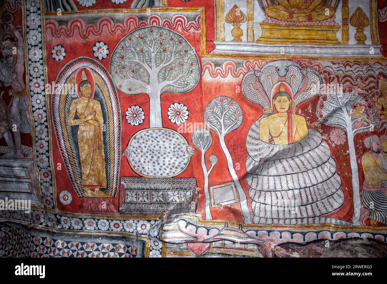 The spectacular interior of Cave Two (Maharaja Viharaya) including a ceiling mural of a Naga ...