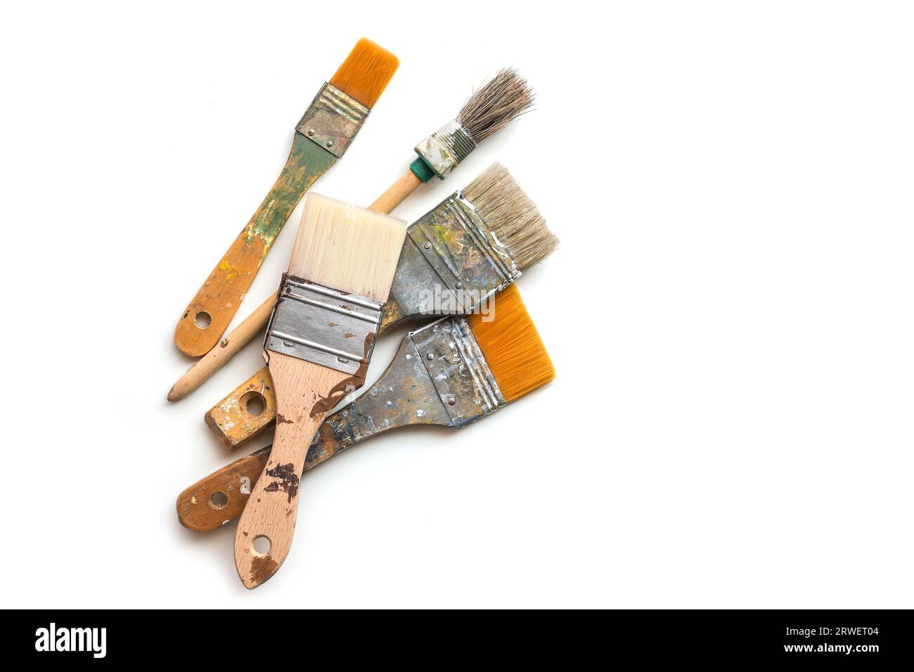 Four used brushes for paint, lacquer, varnish and stain isolated with ...