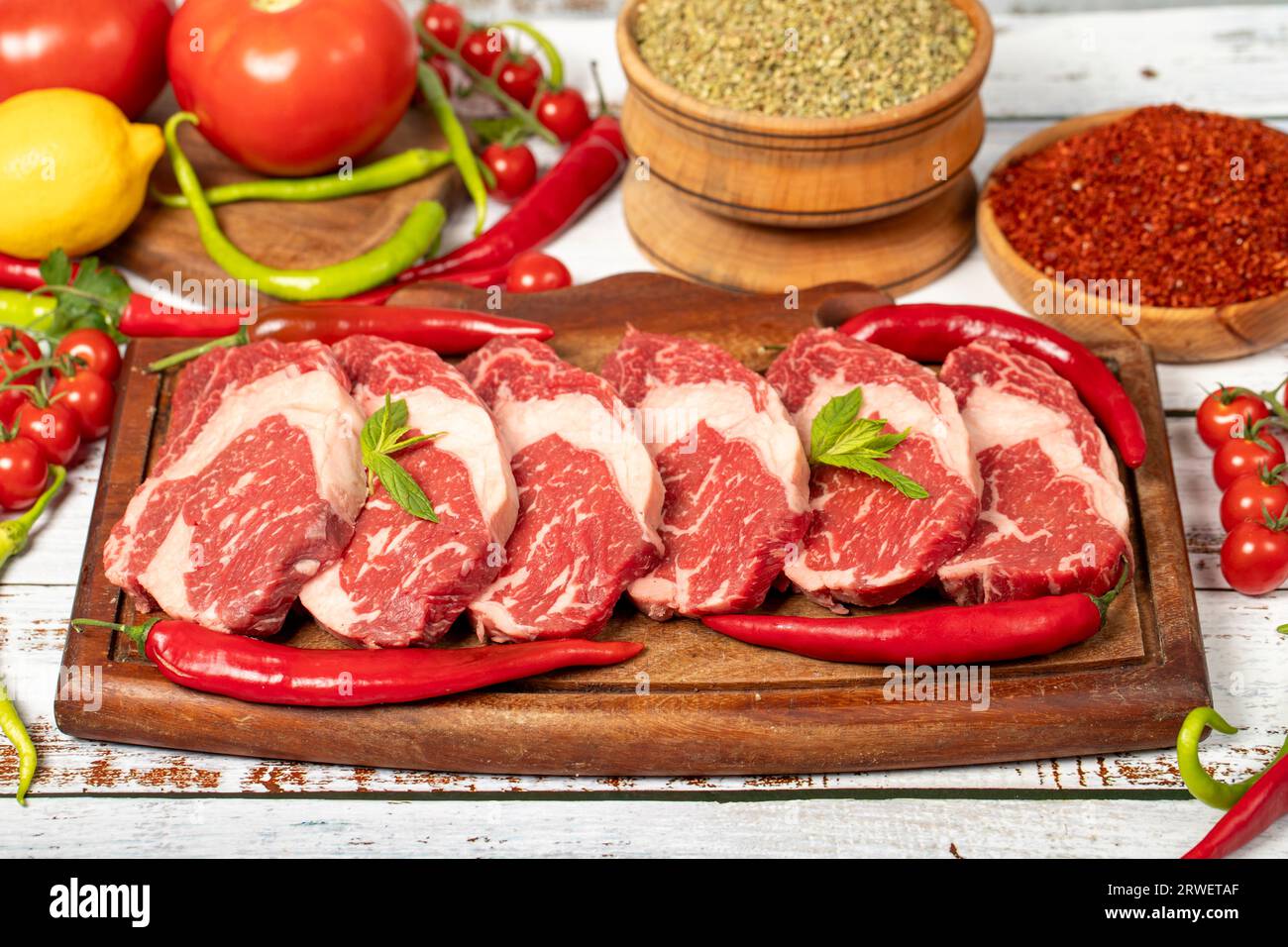 Veal entrecote meat on wood background. Raw beef rib eye steak with ...