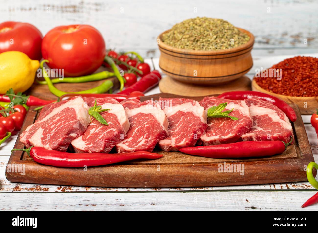 Veal entrecote meat on wood background. Raw beef rib eye steak with ...