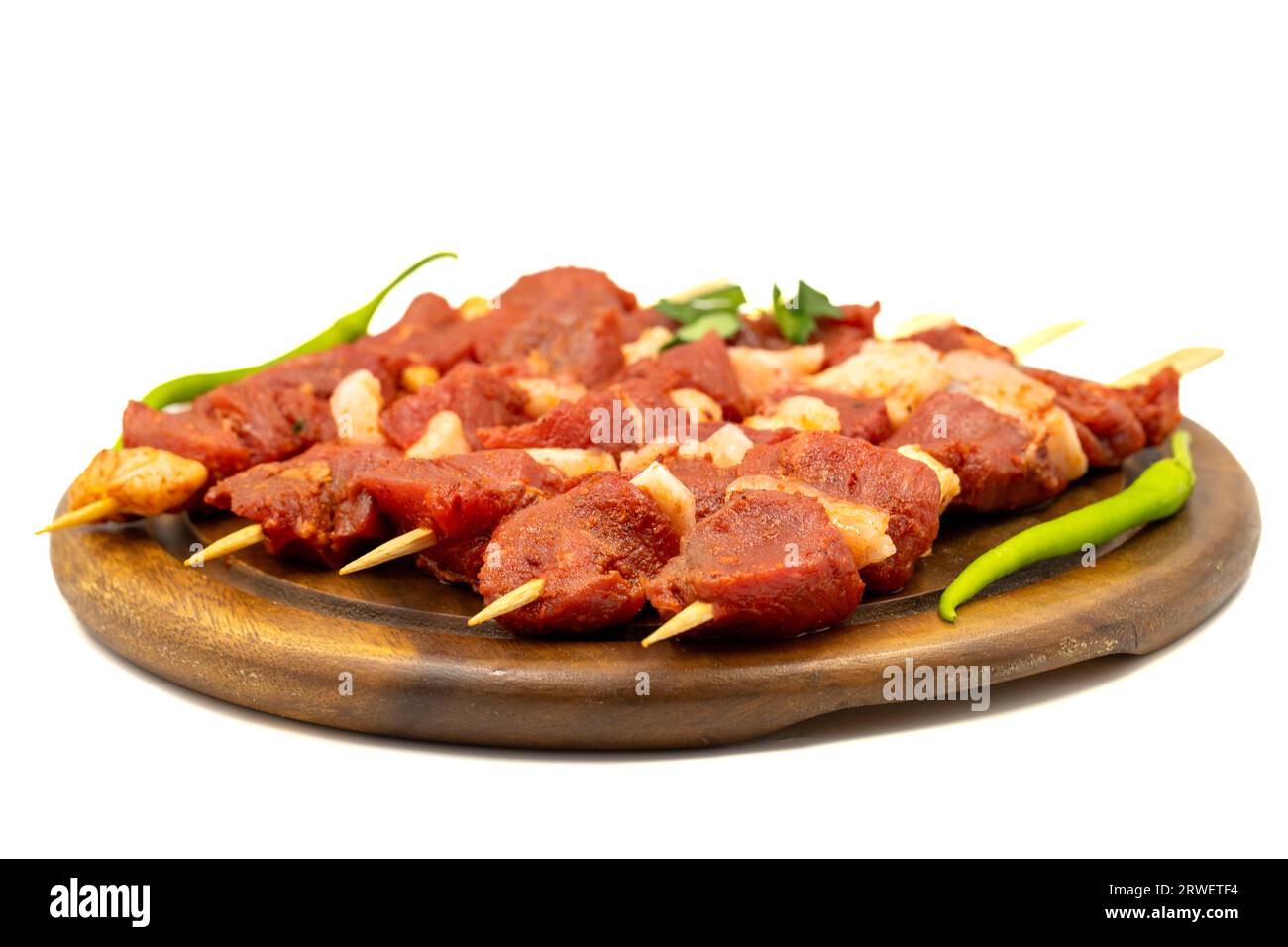Beef tenderloin skewer isolated on white background. Beef tenderloin skewer with raw sauce with ...