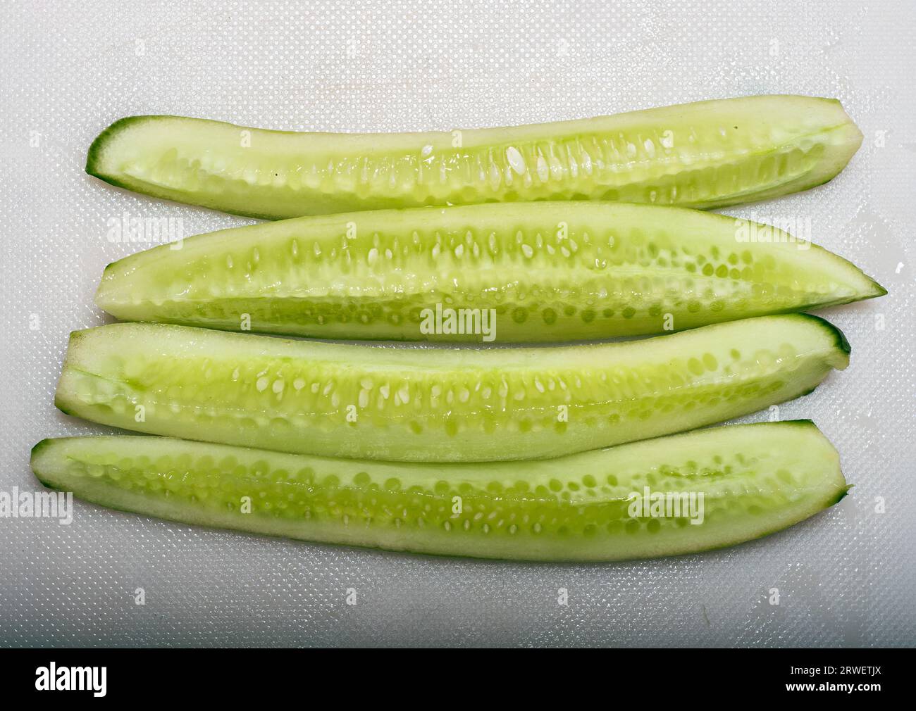 Sliced Green Cucumber pieces Stock Photo - Alamy