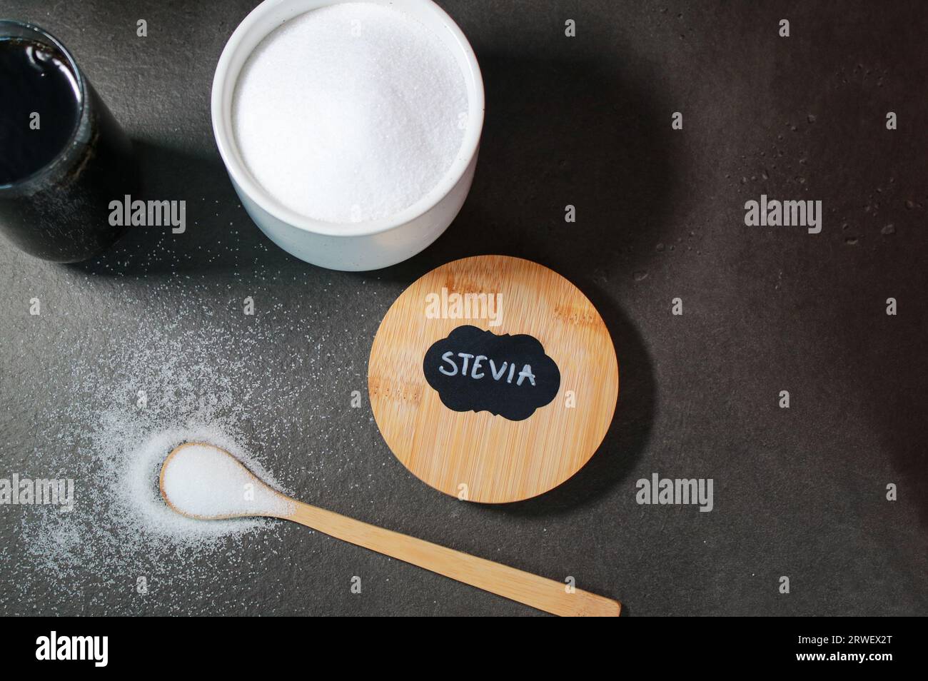 Top vie of a coke drink and natural stevia sweetener with s spoon, grey ...
