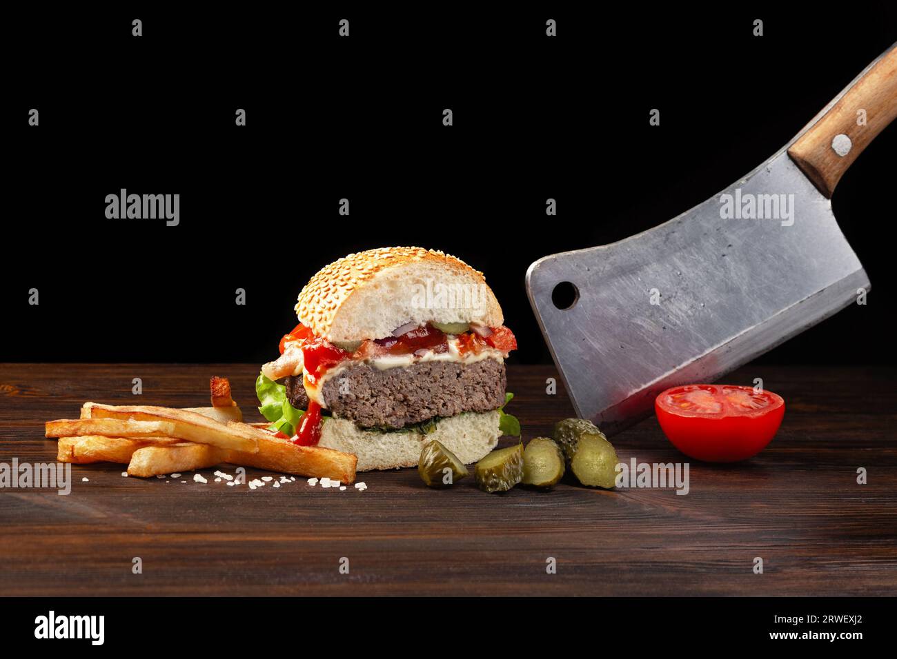 Homemade hamburger cut in half close-up with beef, tomato, lettuce ...