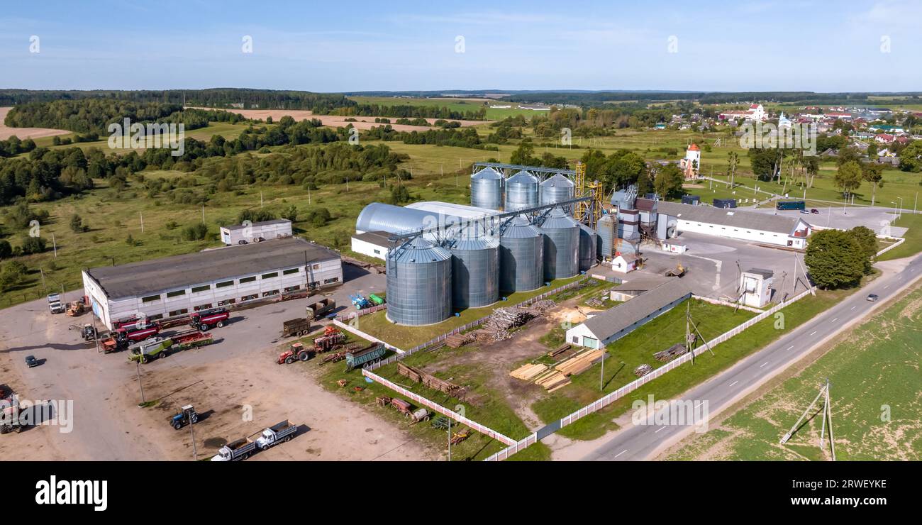 aerial panoramic view on agro-industrial complex with silos and grain ...