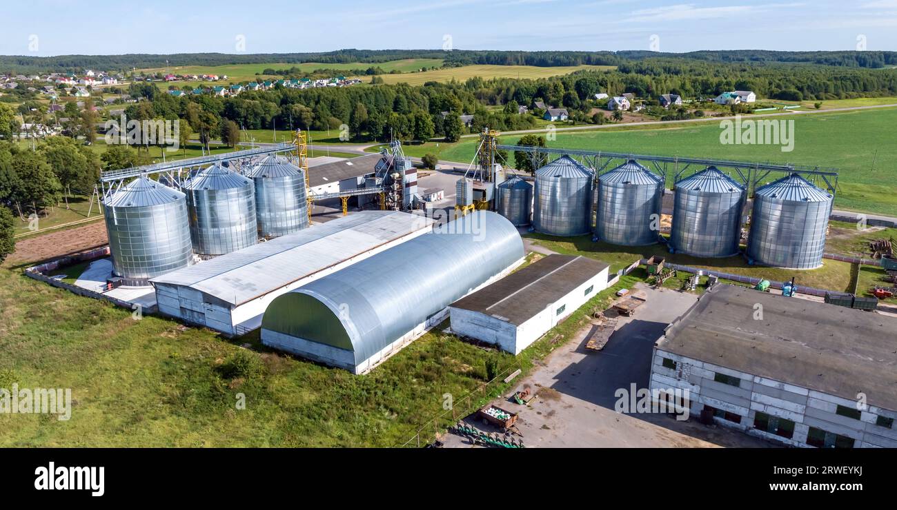 aerial panoramic view on agro-industrial complex with silos and grain ...