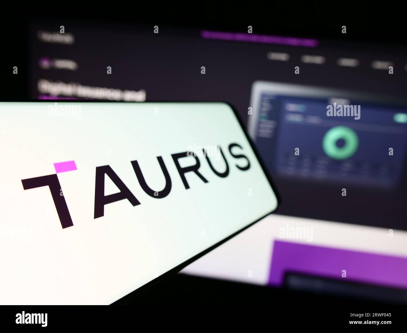 Smartphone with logo of Swiss digital assets company Taurus SA on ...