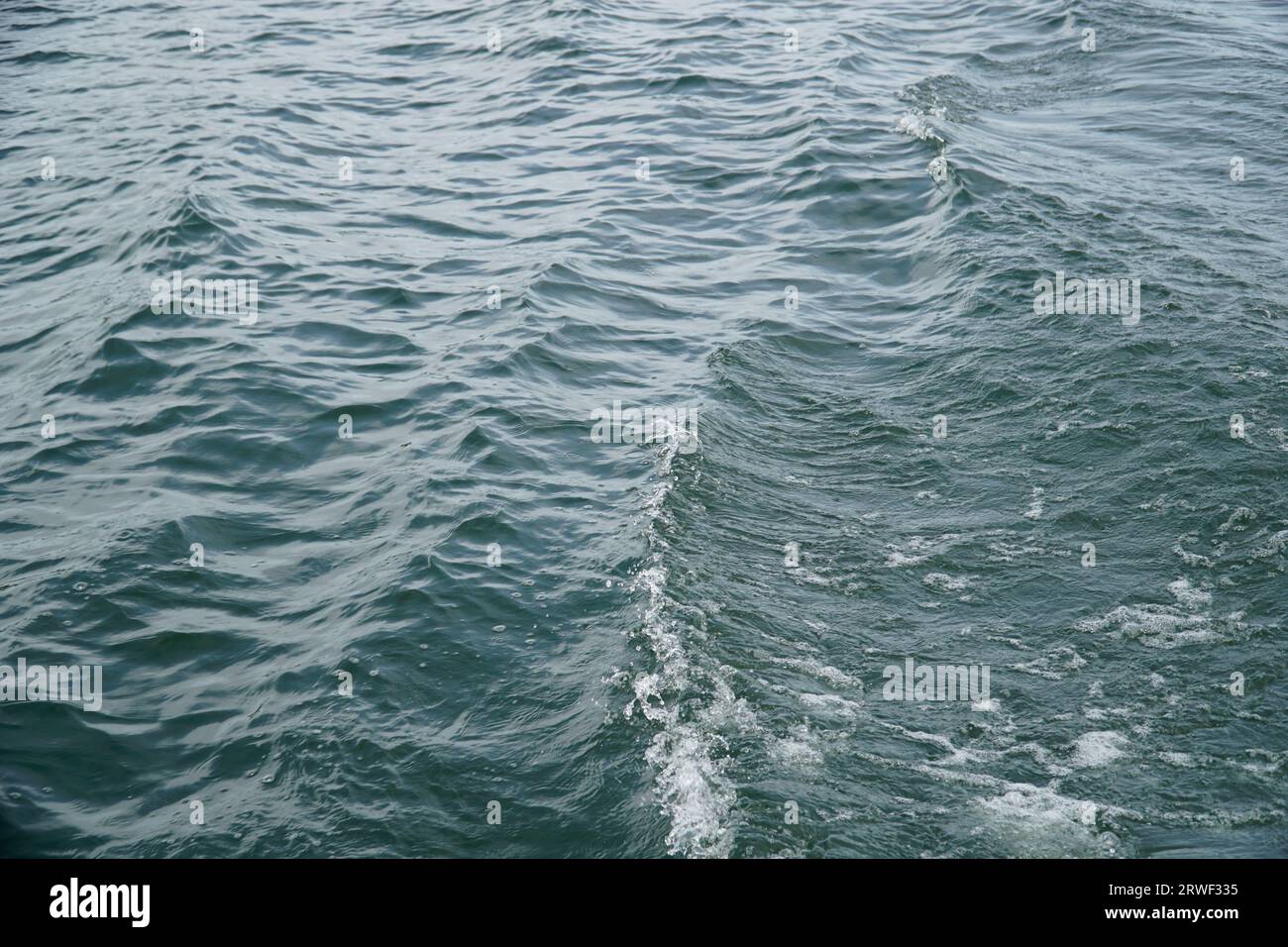 Rough water surface with waves Stock Photo - Alamy