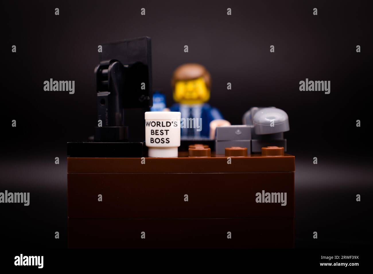 Manager's office, a World's best boss cup in front of him Stock Photo ...