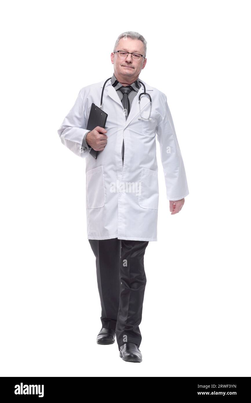 Full length portrait of a smiling male doctor walking towards the ...