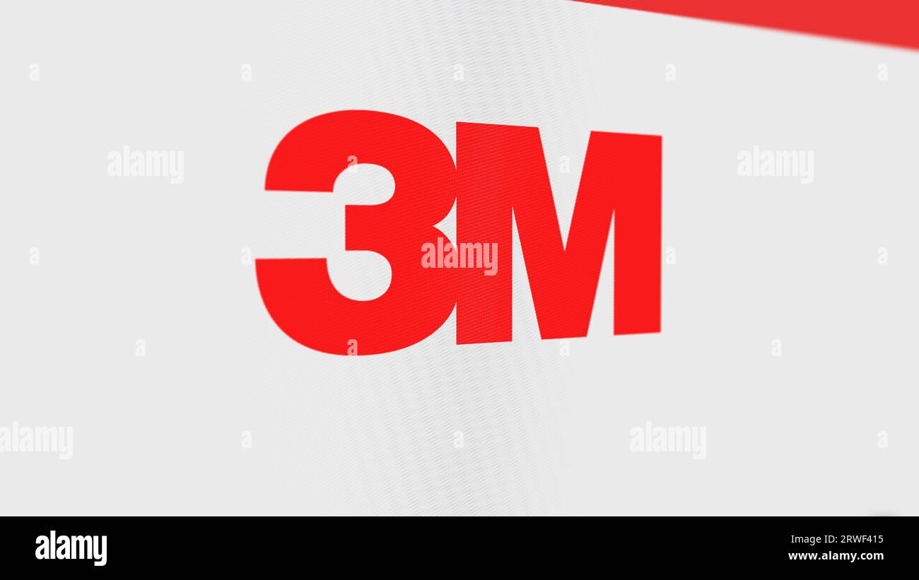 The logo of 3M on a white wall of screens. 3M brand on a device Stock ...