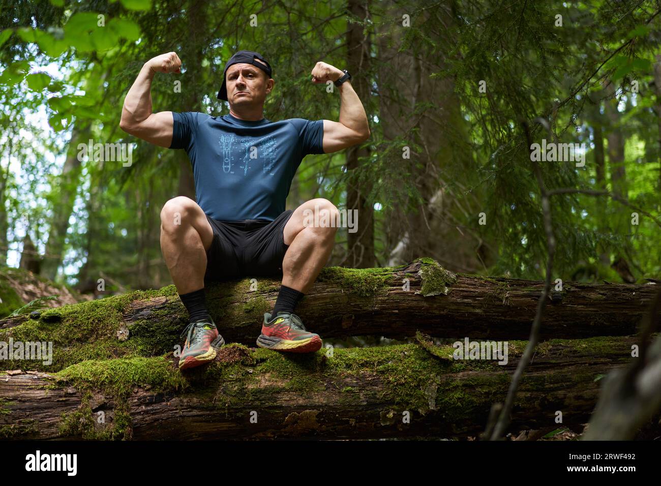 Male tourist sitting on log hi-res stock photography and images - Alamy