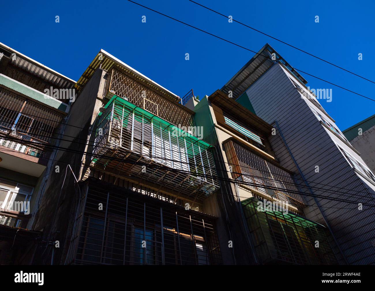 Buildings with fences protections on the windows, New Taipei, Tamsui ...