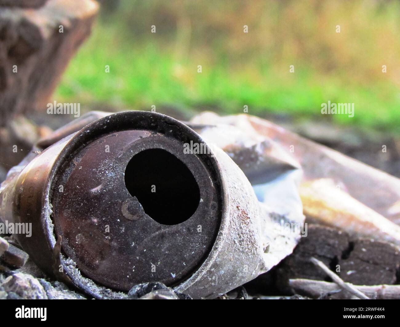 A burnt beer can lies in the hearth from the fire Stock Photo - Alamy