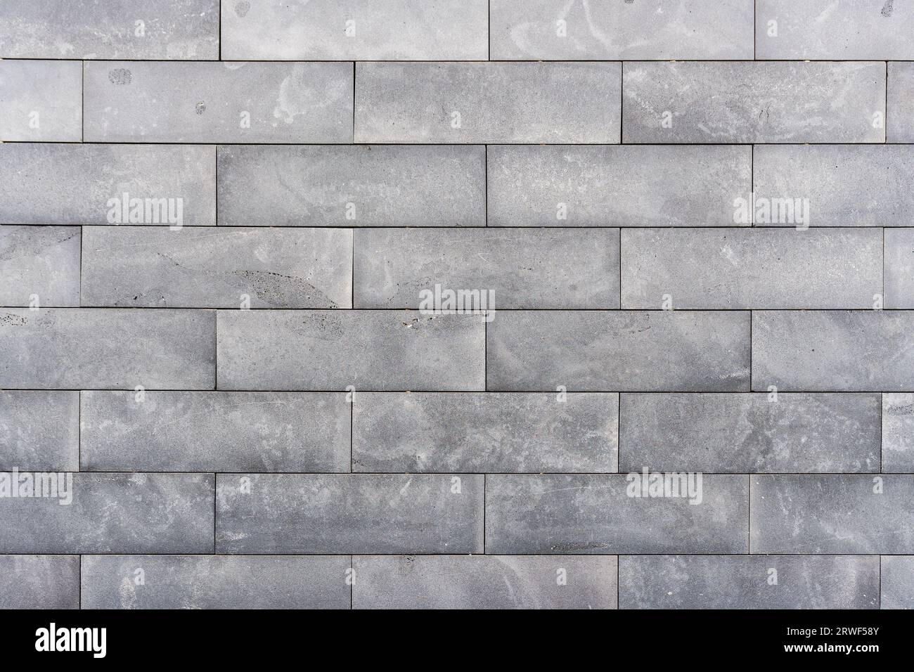 Old grey brick wall background. Texture of building wall Stock Photo ...