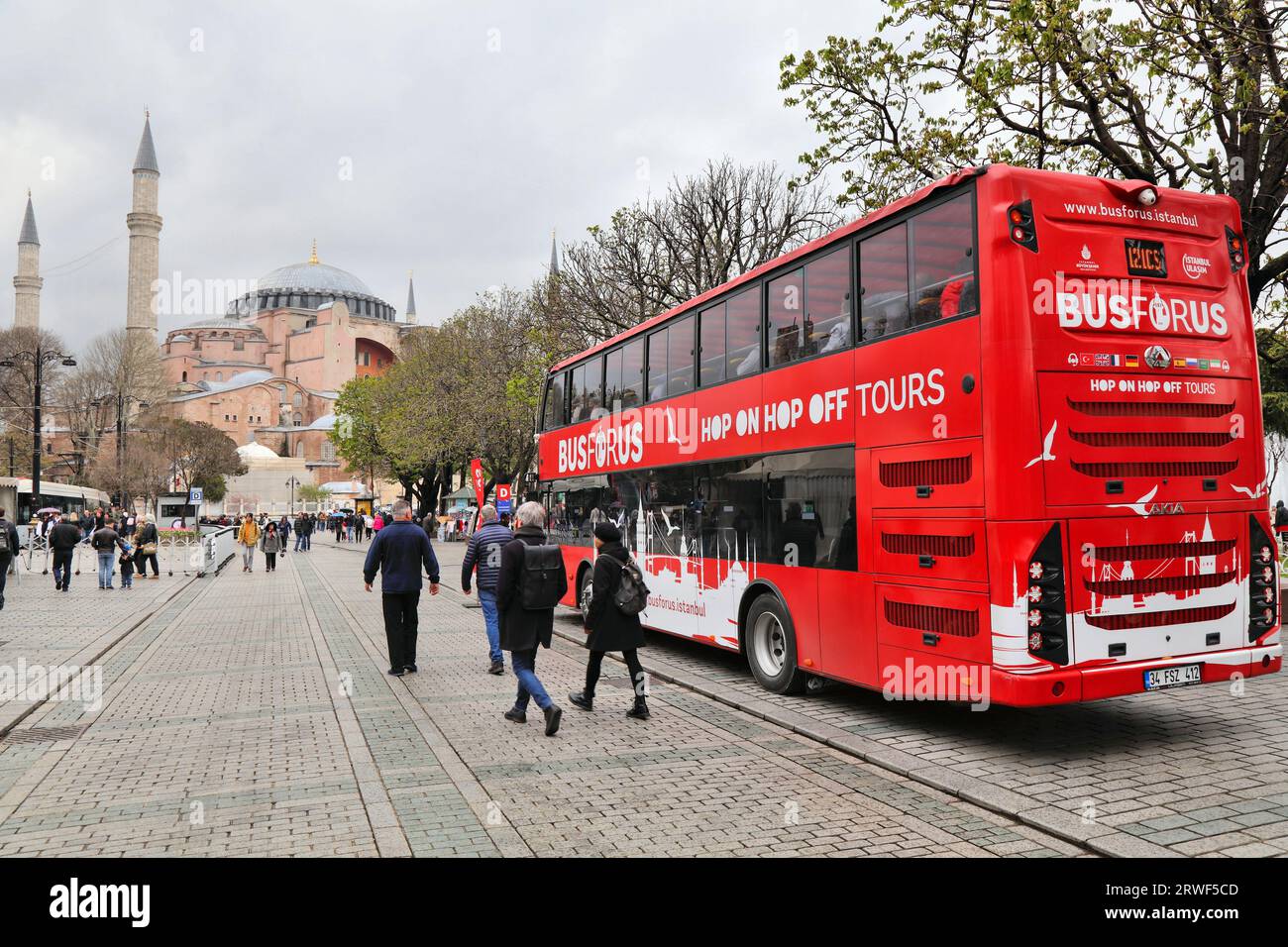 ISTANBUL, TURKEY - APRIL 11, 2023: Tourists ride hop on hop off bus ...