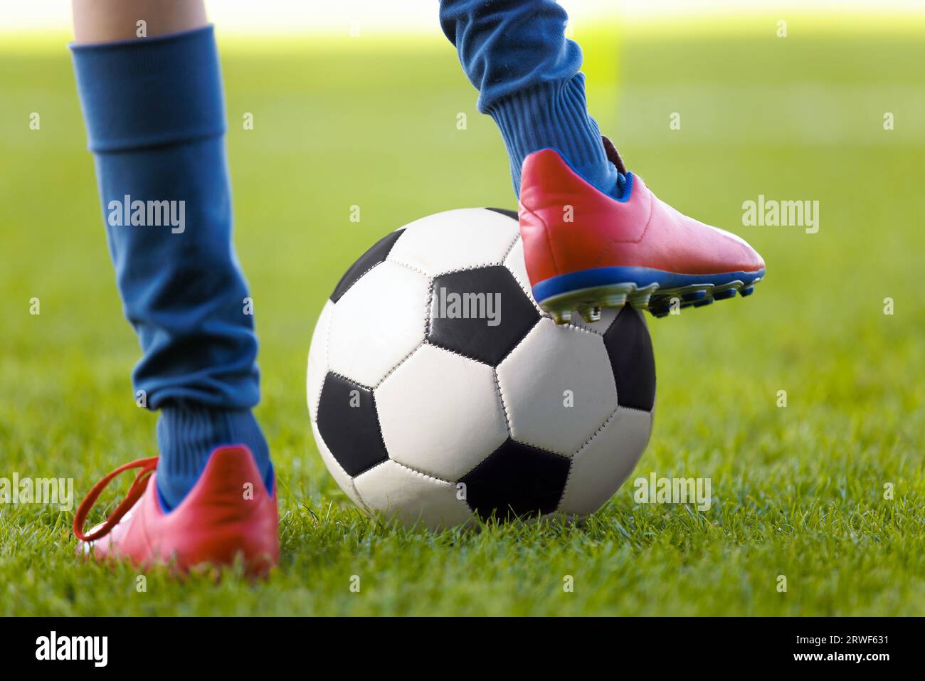 Player Kick a Soccer Ball on a Grass Pitch. The Perfect Football Kick ...